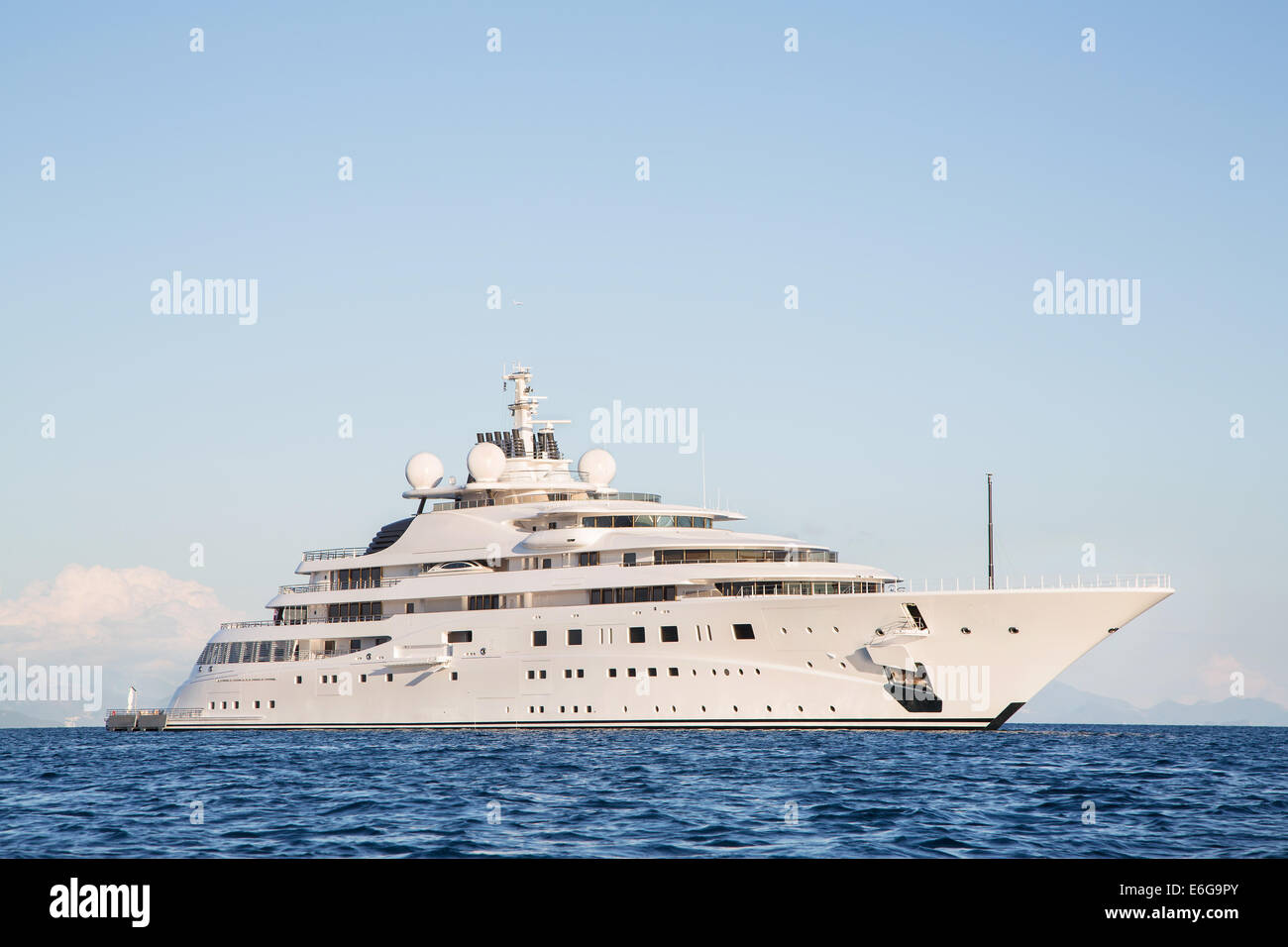 Gigantic big and large luxury mega or super motor yacht on the blue ...