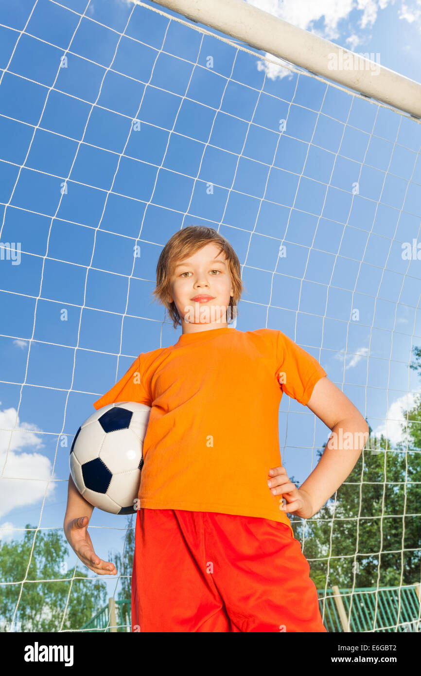 Child playing football in stadium hi-res stock photography and images ...