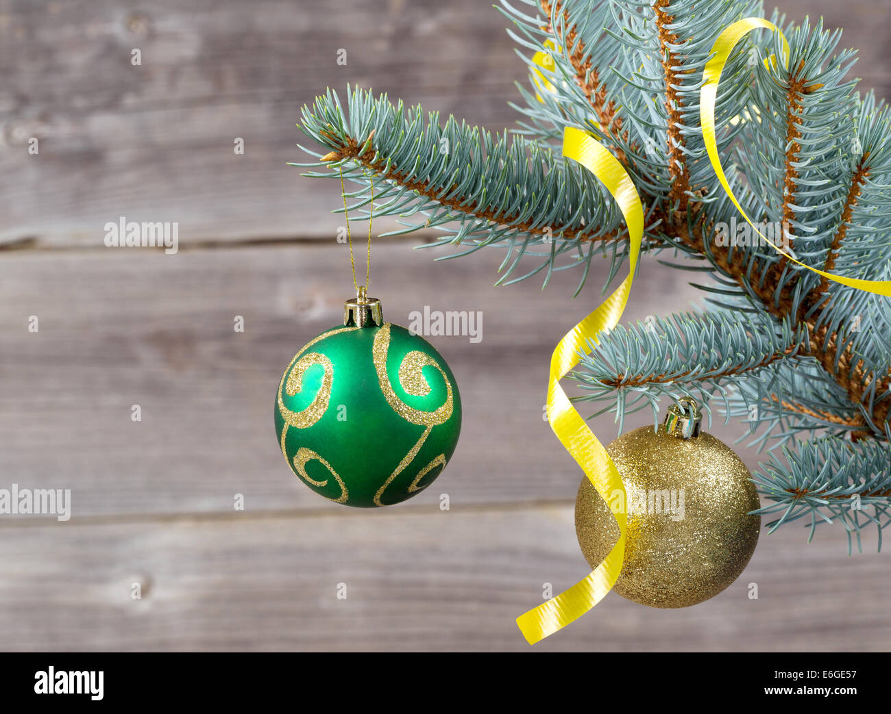 Horizontal image of Christmas ornaments and yellow ribbon hanging from ...