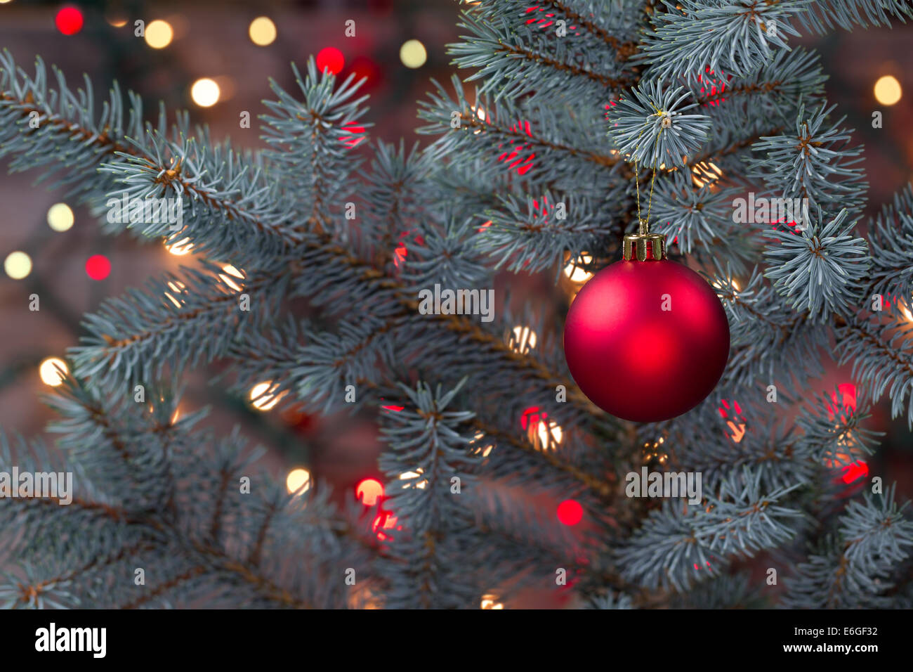 Closeup horizontal image of a single red Christmas ornament hanging ...