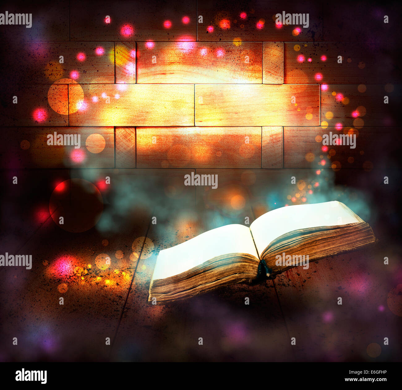 Old book with magic Ray of light Stock Photo - Alamy