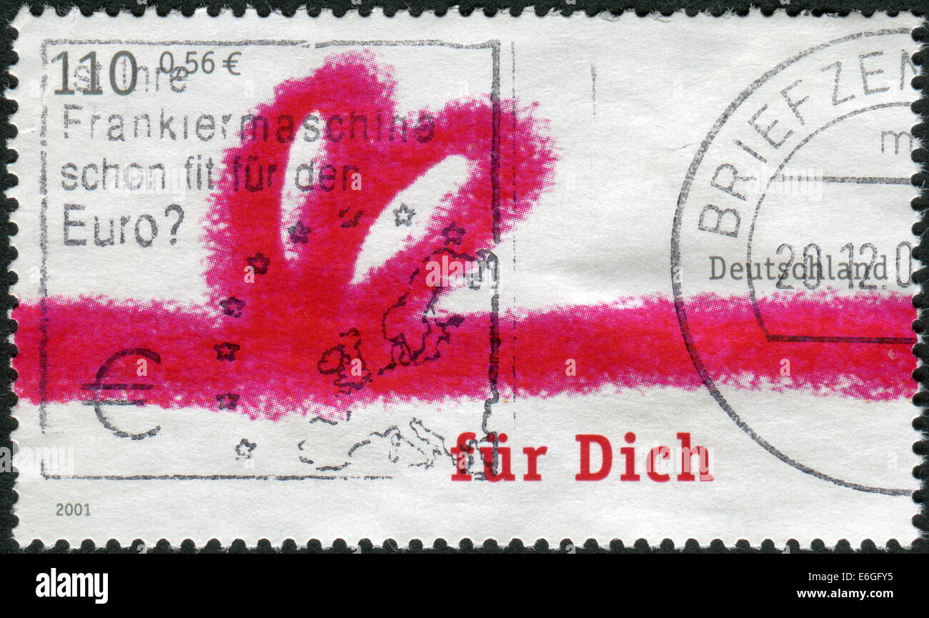 Postage stamp printed in Germany, shows a gift ribbon tied in the shape ...