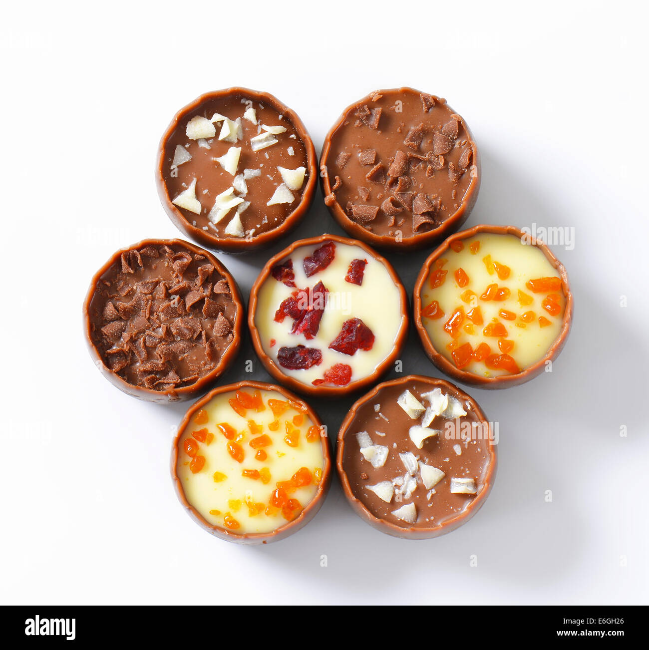 Delicate milk chocolate cups with liqueur and ganache centres Stock ...