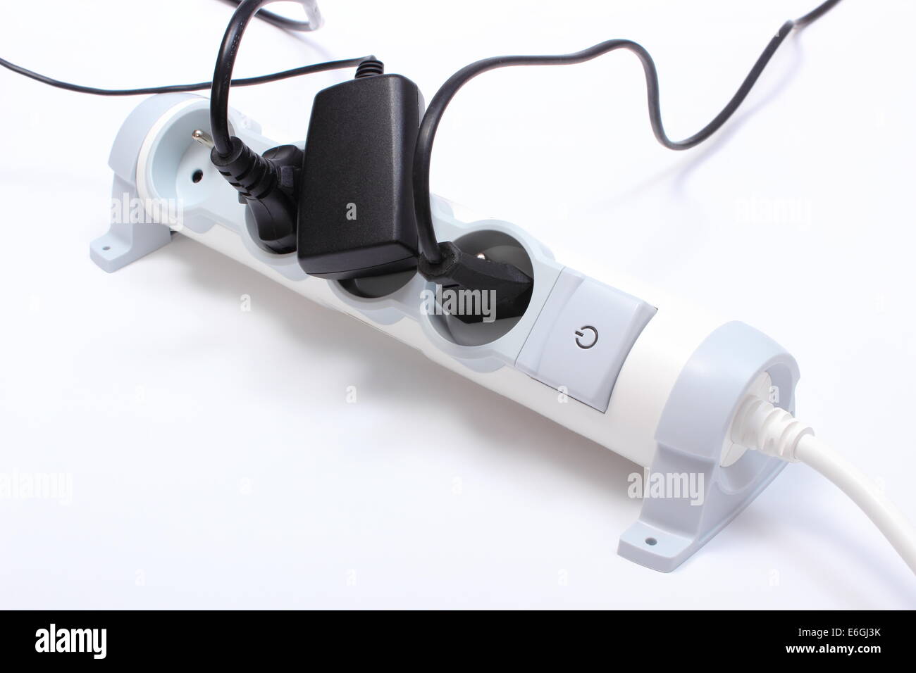 Electrical plugs with cords connected to electrical power strip ...