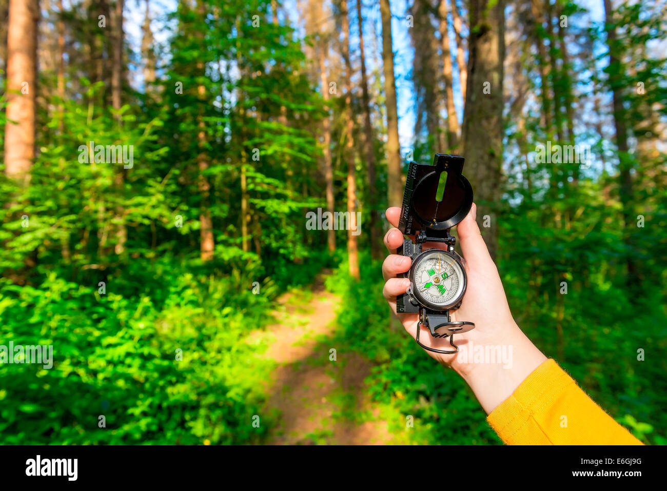 Hand holding a compass hi-res stock photography and images - Alamy