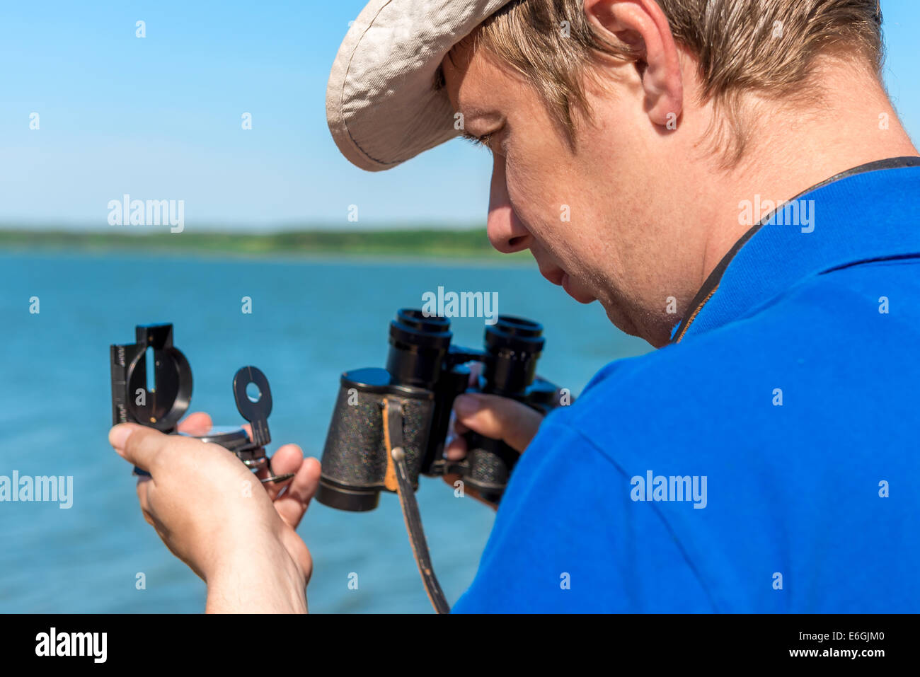 traveler with a compass and binoculars Stock Photo - Alamy