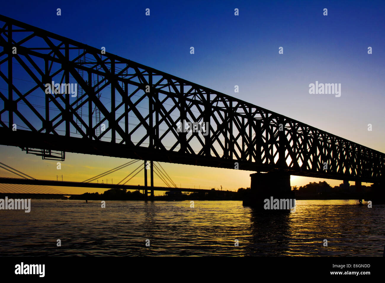 An old bridge construction silhouette at sunset Stock Photo - Alamy
