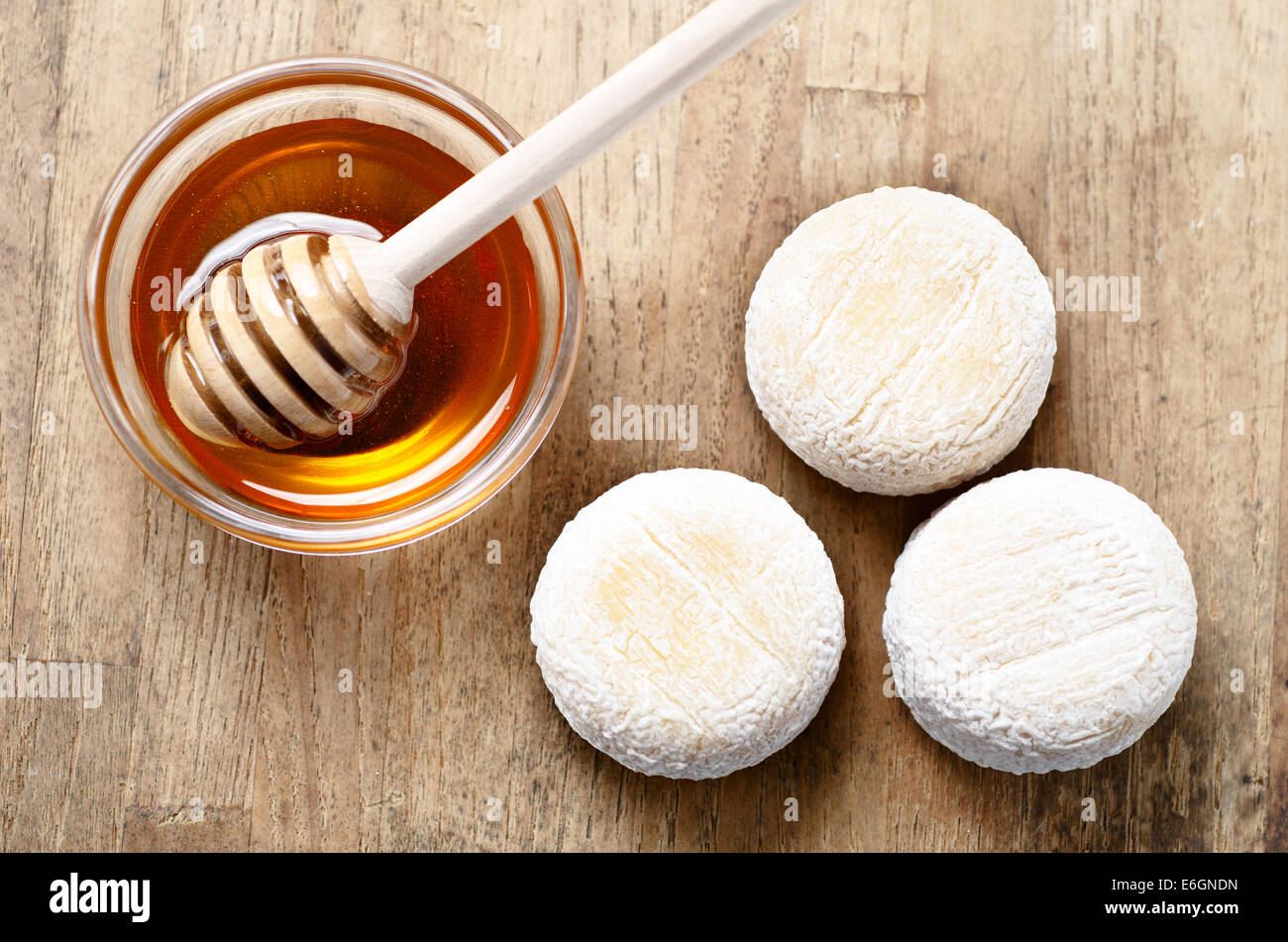French fresh goat cheese called crottin de chavignol and honey Stock ...