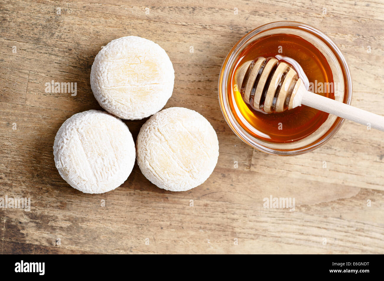 French fresh goat cheese called crottin de chavignol and honey Stock ...