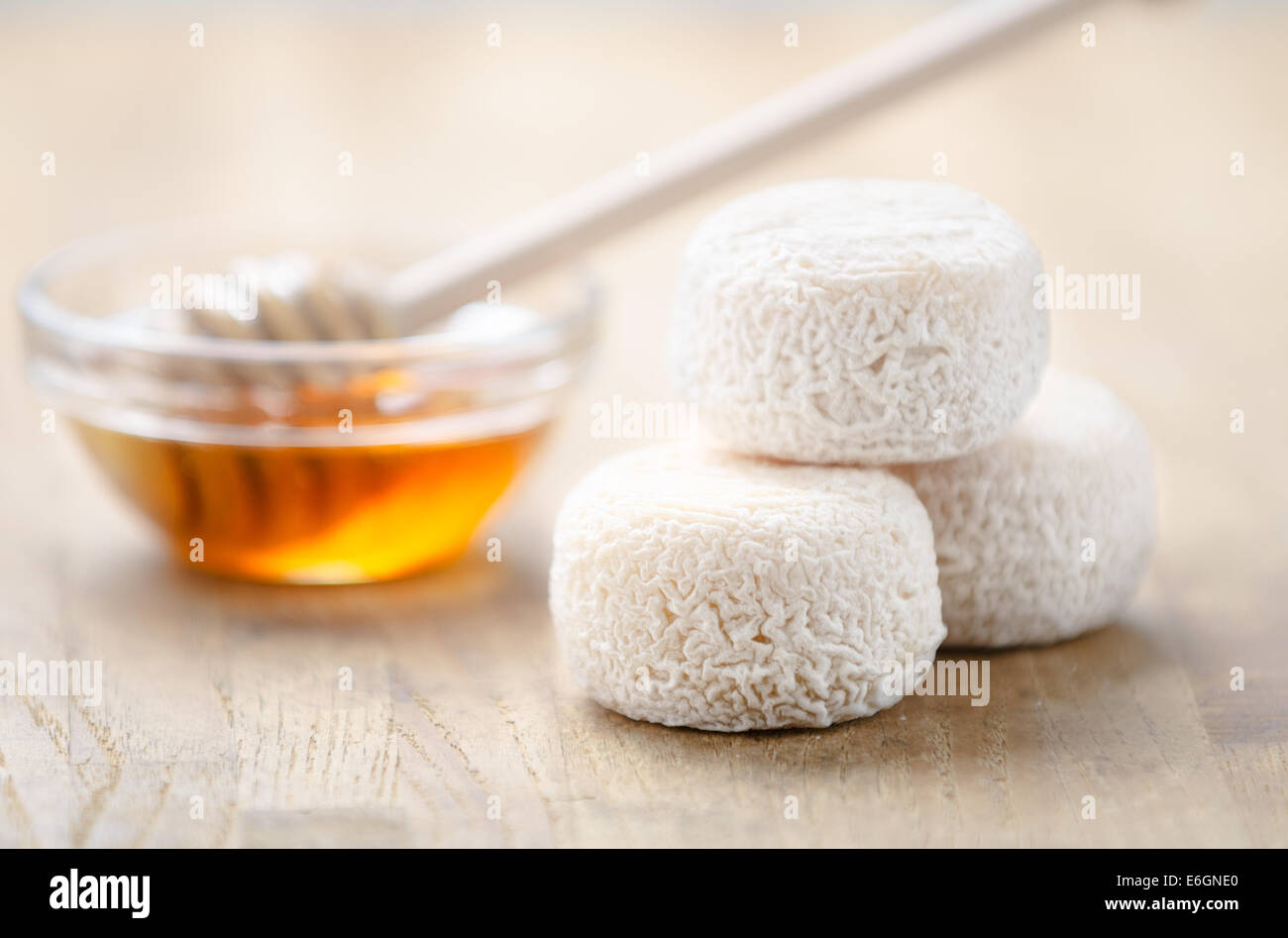 French fresh goat cheese called crottin de chavignol and honey Stock ...