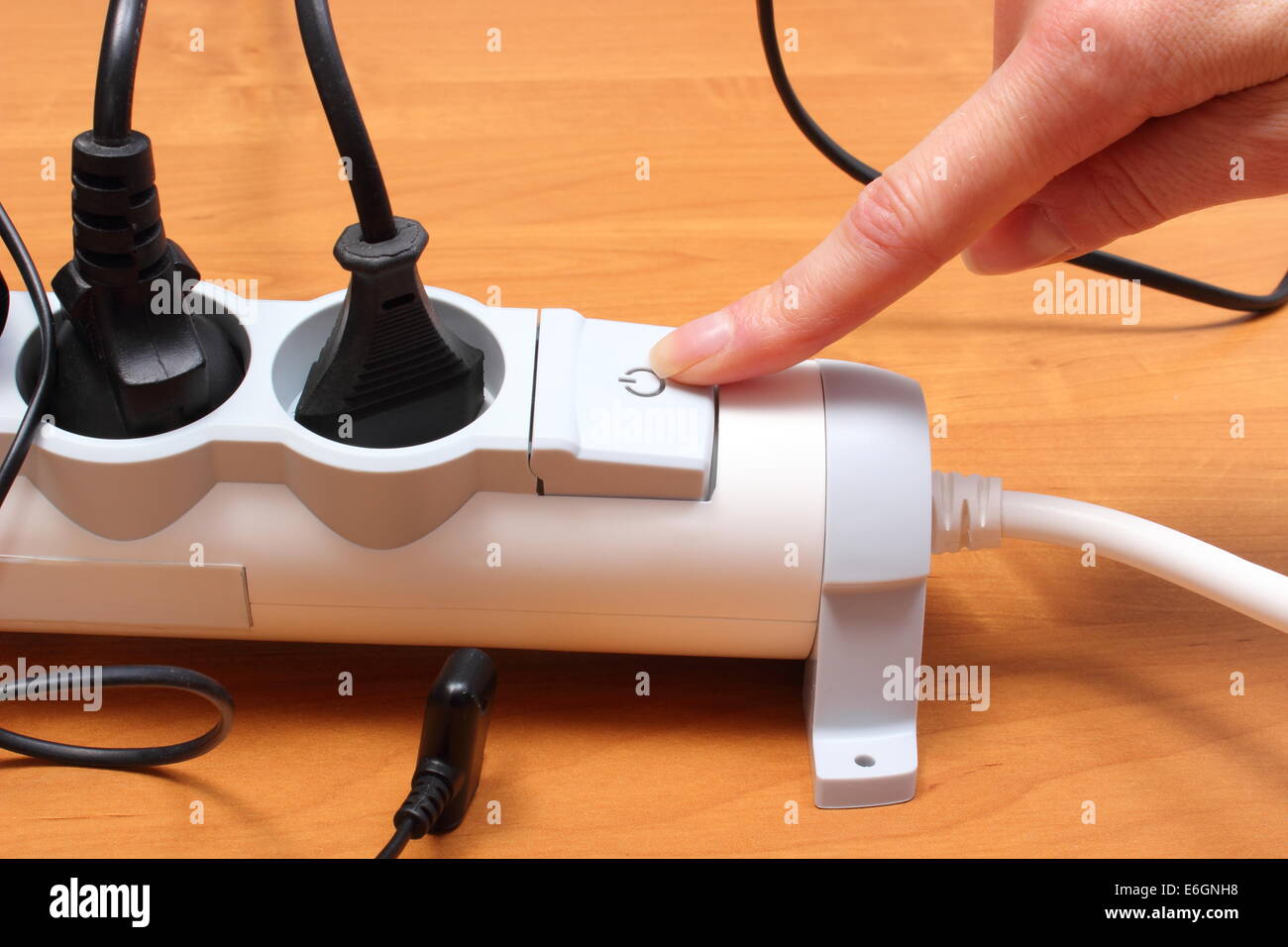 Electrical plugs with cords connected to electrical power strip ...