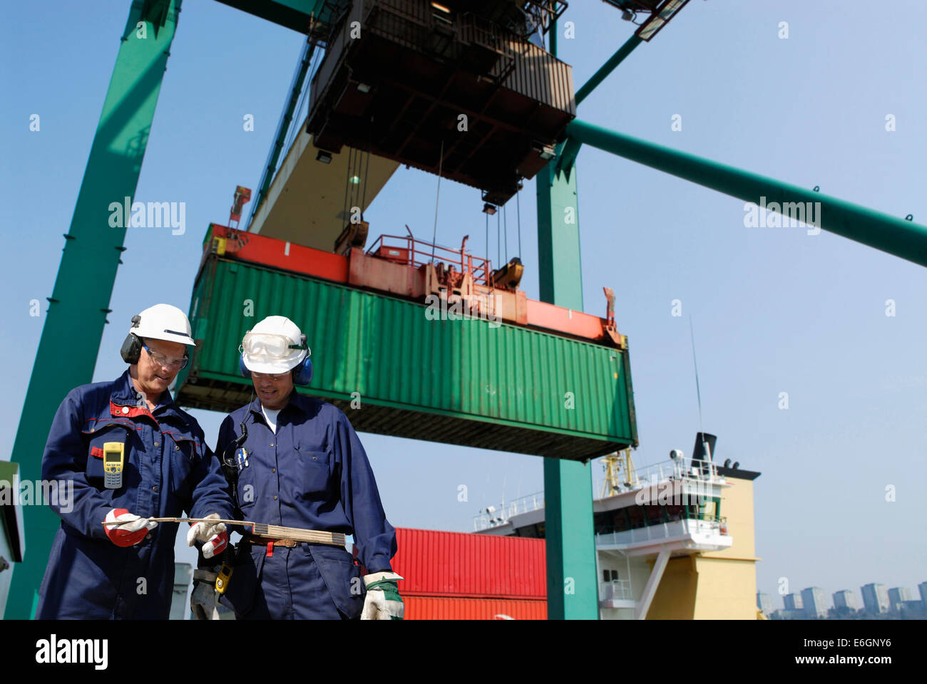 Shipping container port workers hi-res stock photography and images - Alamy