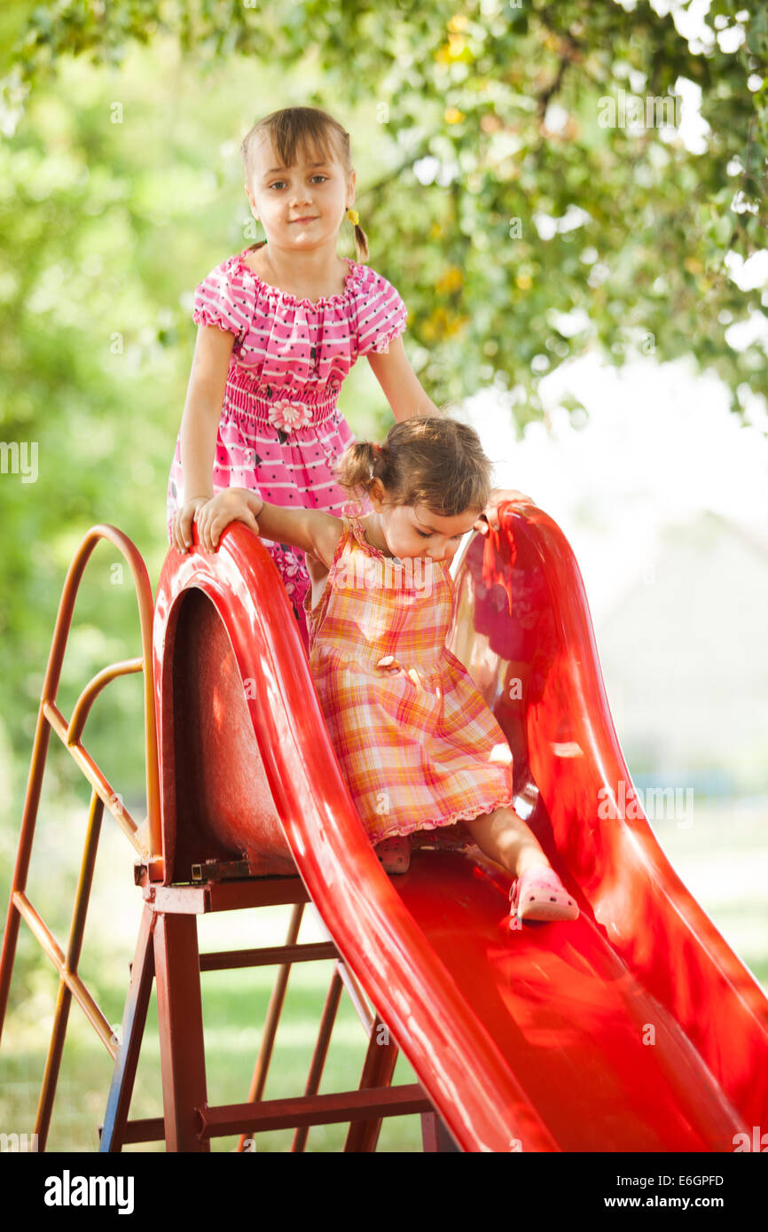 girls on the slide Stock Photo - Alamy