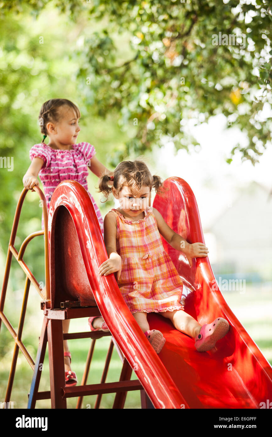 girls on the slide Stock Photo - Alamy