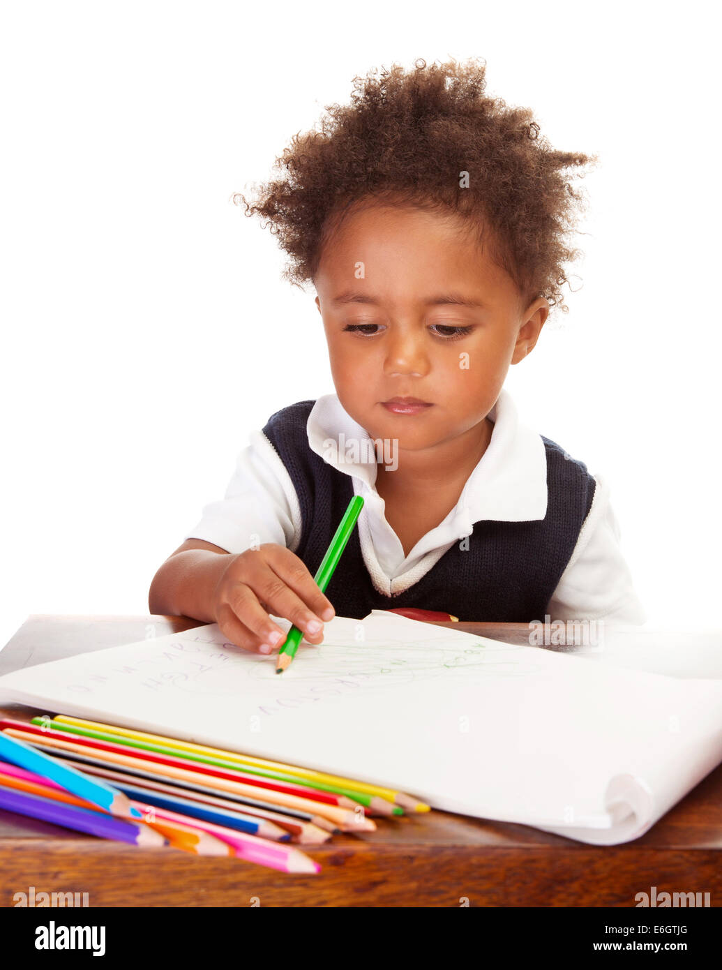 Portrait of adorable sweet little black boy drawing using many colorful ...