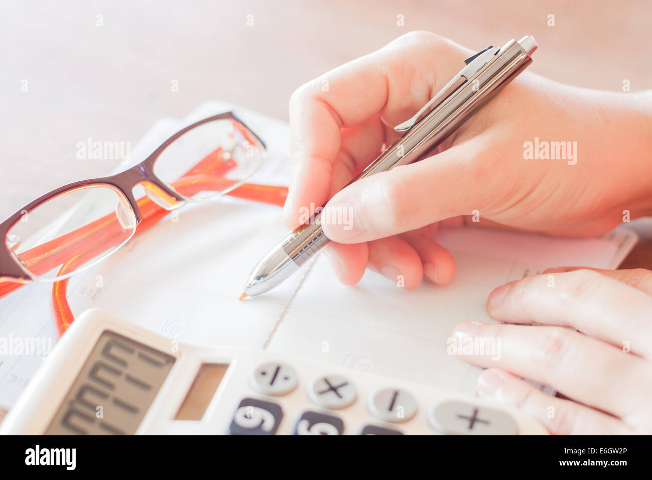 Working with the calculator hi-res stock photography and images - Alamy