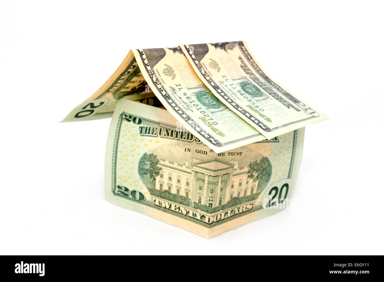 the house made of Dollars on the white background. Isolated on white ...