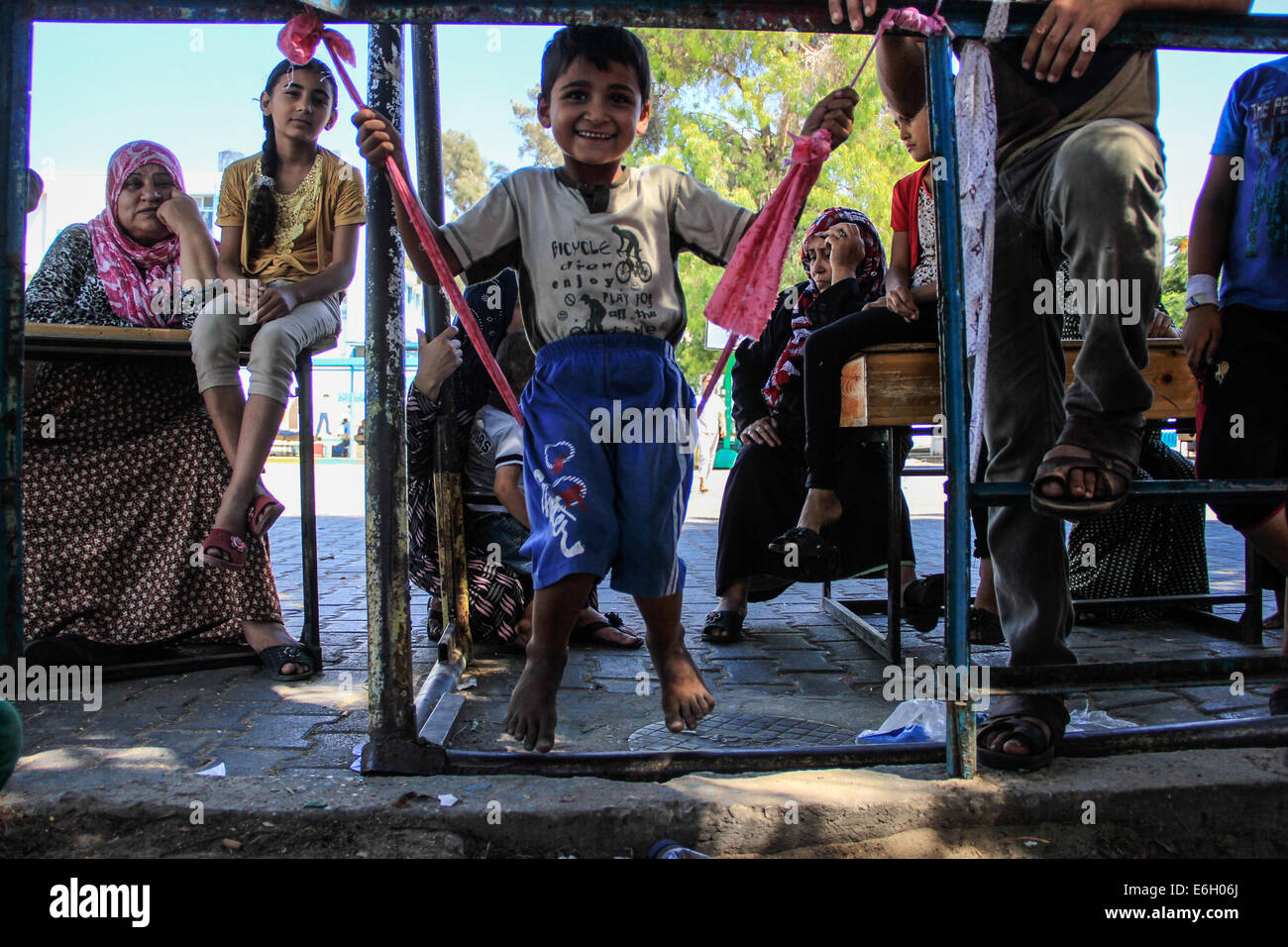 The displaced Palestinian children happily play in the camp where they ...
