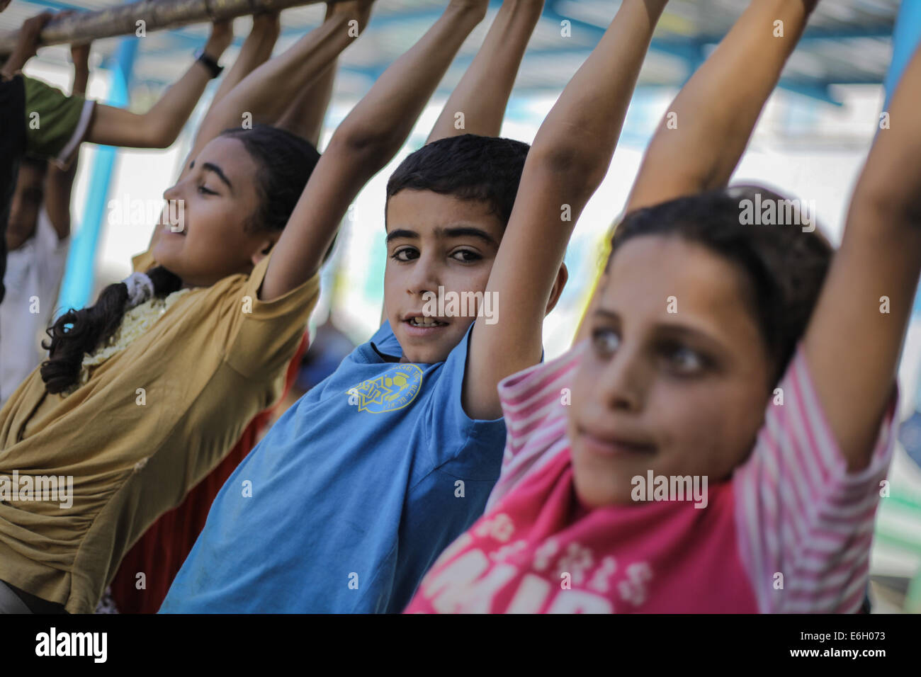 The displaced Palestinian children happily play in the camp where they ...