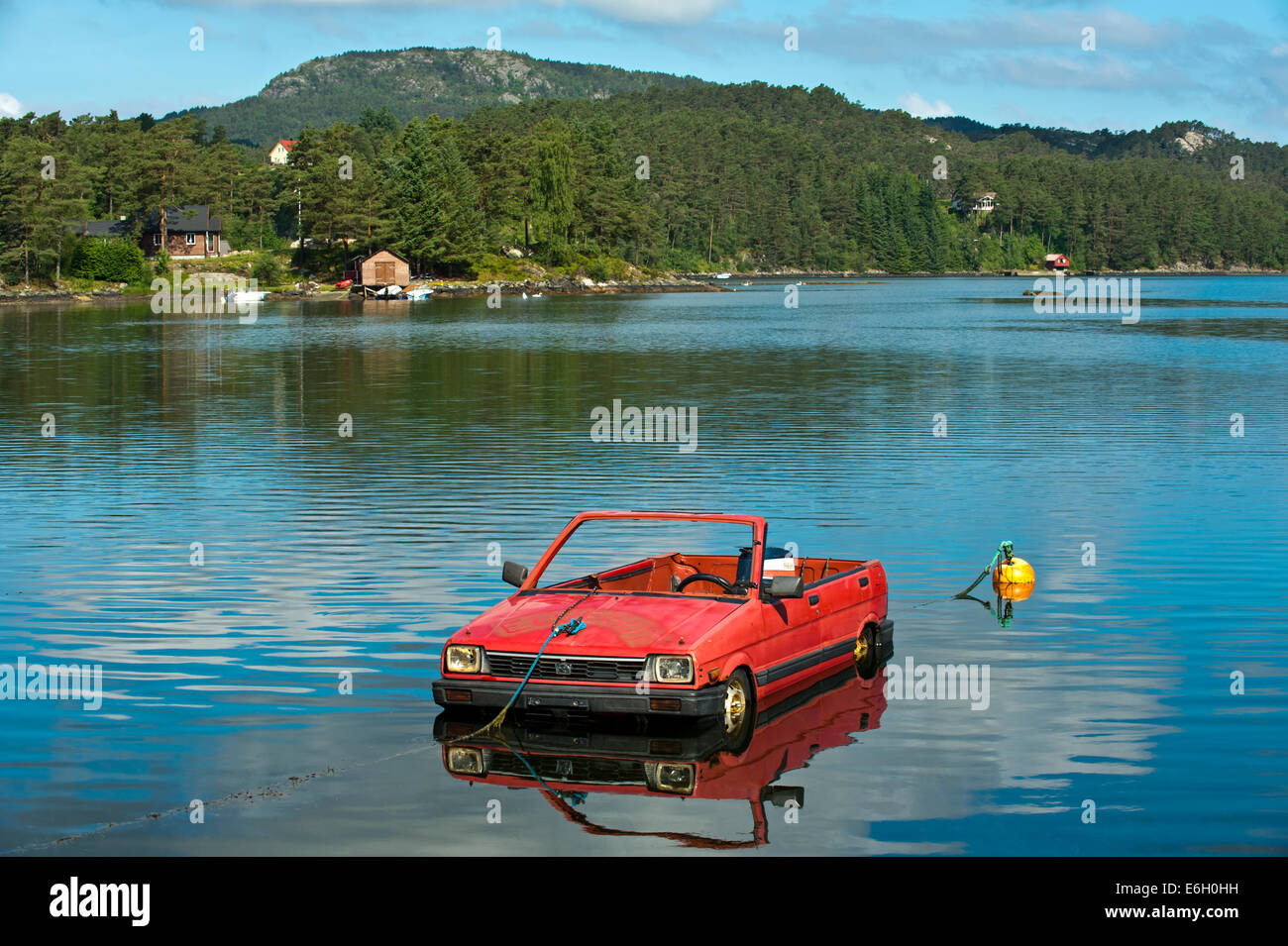 A Subaru passenger car turned into a boat floating on a lake, Norway ...