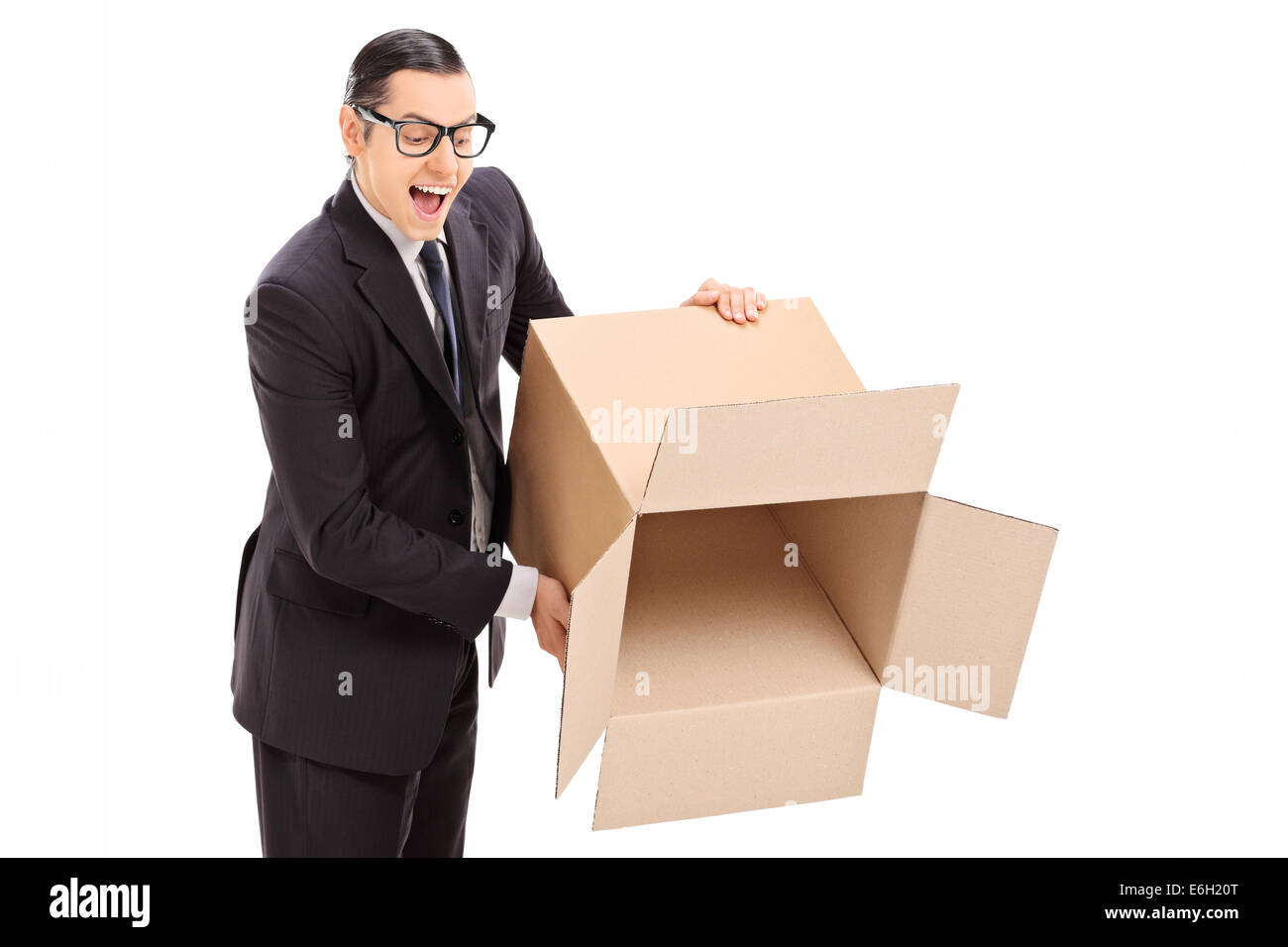 Businessman holding an empty box isolated on white background Stock ...