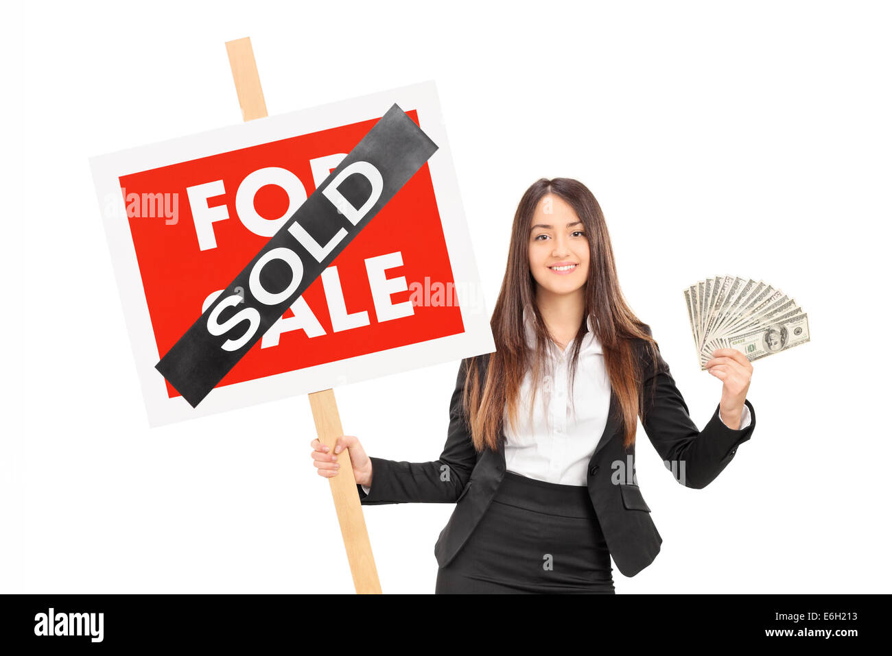 Female realtor holding sold sign hi-res stock photography and images ...
