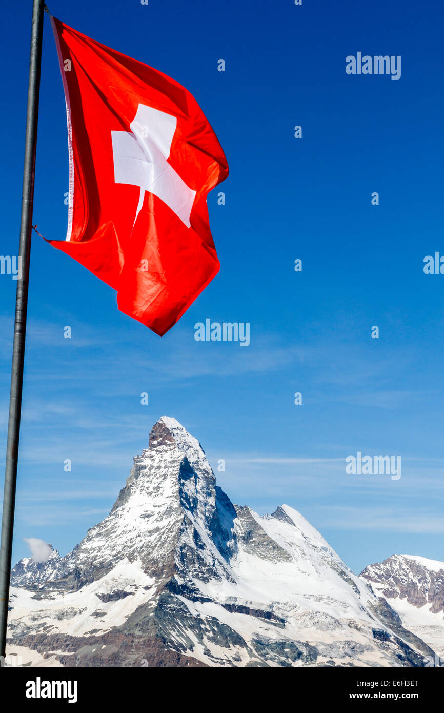 Swiss Flag Flying Over the Matterhorn, Zermatt, Switzerland Stock Photo ...