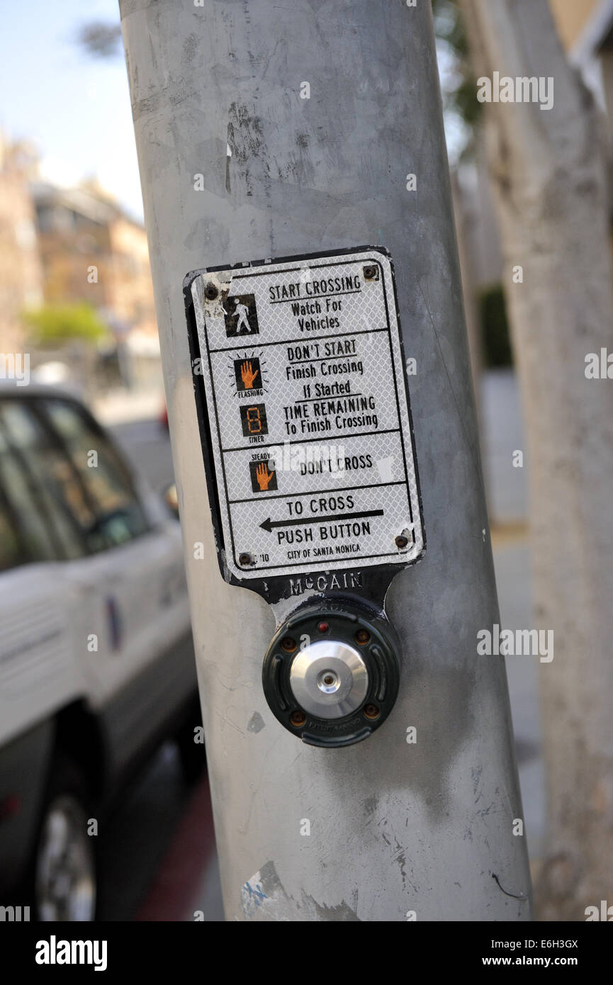 Crosswalk pedestrian button and sign explaining pedestrian traffic ...