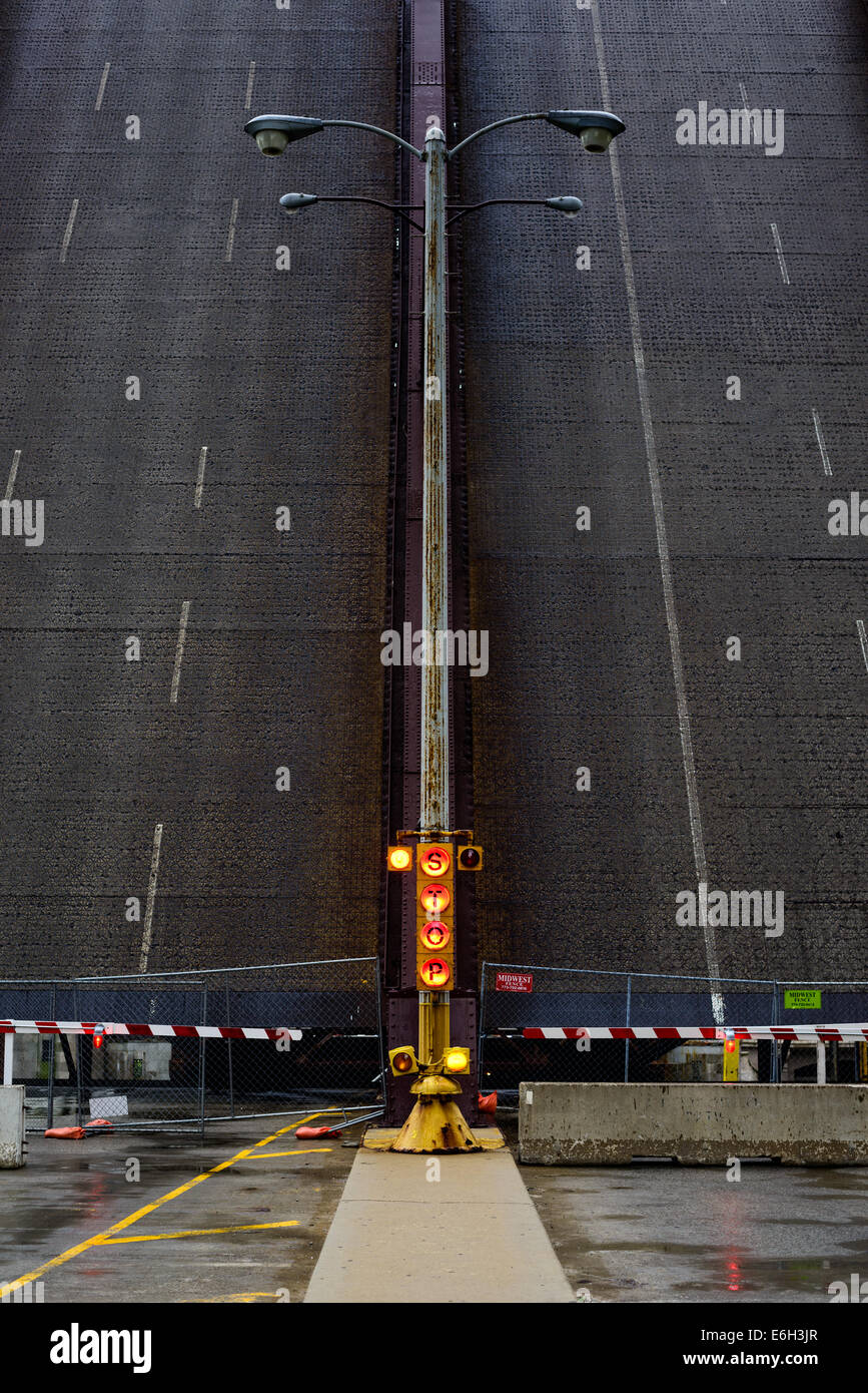 A bridge over the chicago river is raised, blocking traffic from ...