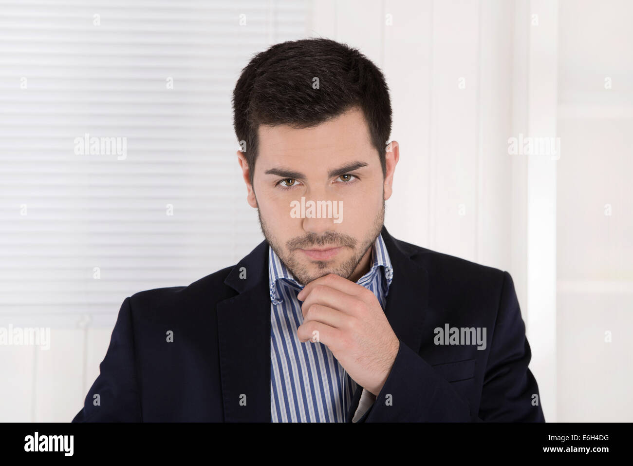Portrait of a serious arrogant isolated businessman in the office Stock ...
