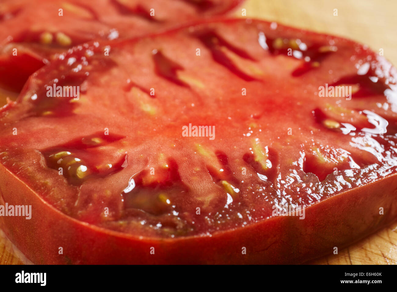 Sliced red heirloom tomatoes Stock Photo - Alamy