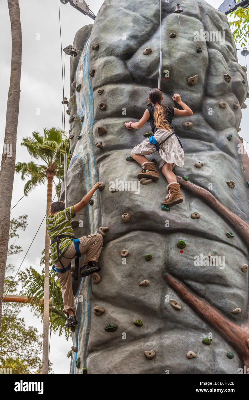 Children climbing rock wall in Jurassic Park attraction at Universal ...