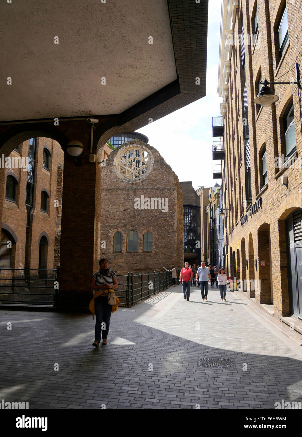 Pedestrian walk way Pickfords Wharf, River Thames south bank Southwark ...