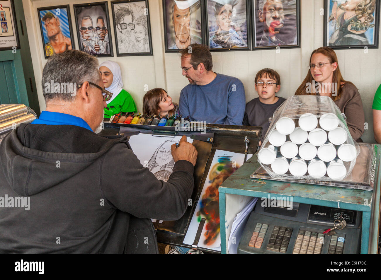 Caricature artist drawing family picture at Universal Studios Islands ...