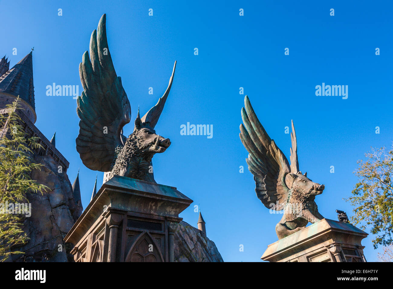 Winged hog statues and Hogwarts castle spires at The Wizarding World of ...