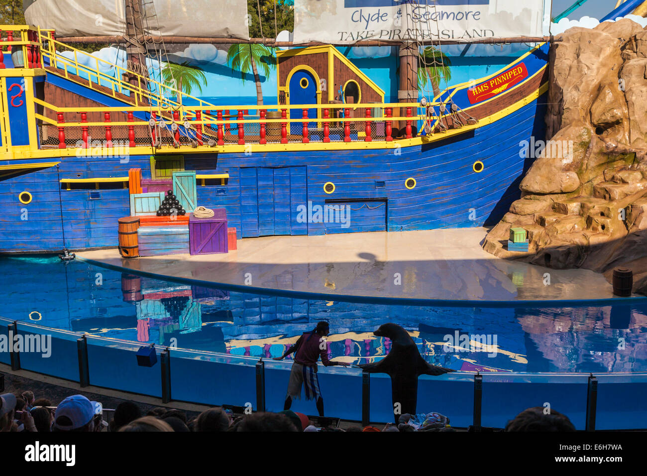 Animal trainer and sea lion performing in the Clyde & Seamore show at ...