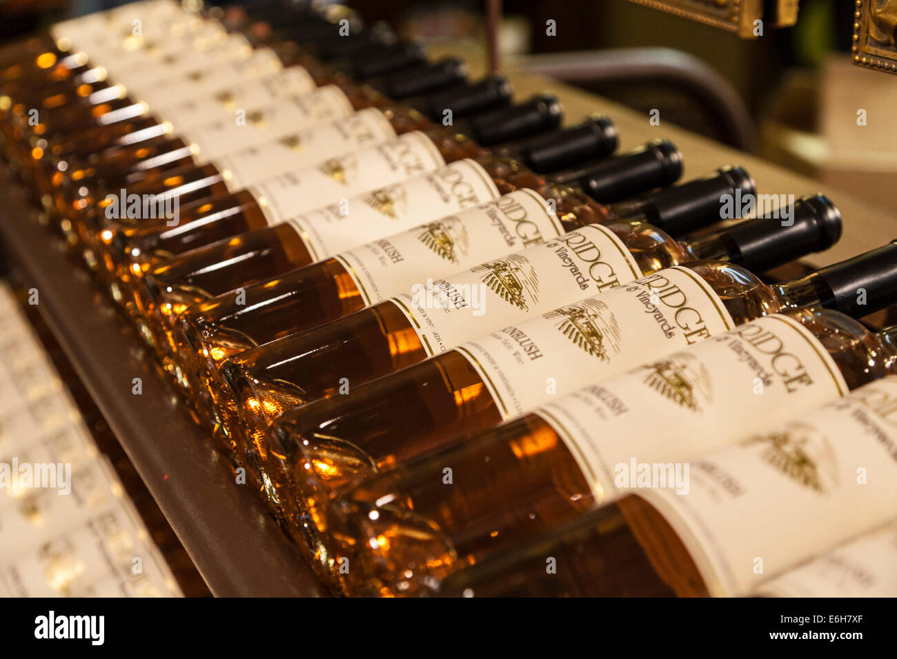 Bottles of Sunblush white wine on shelves at the Lakeridge Winery and ...