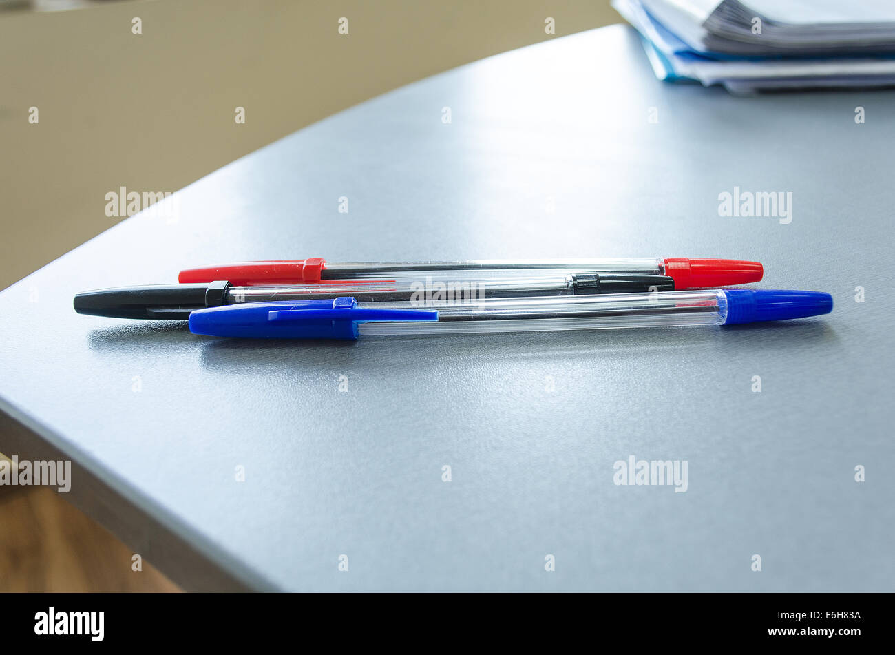 Three multicolor felt pens on wooden desk Stock Photo - Alamy