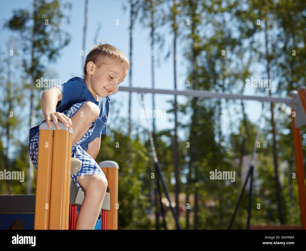 Young boy child climb playground hi-res stock photography and images ...