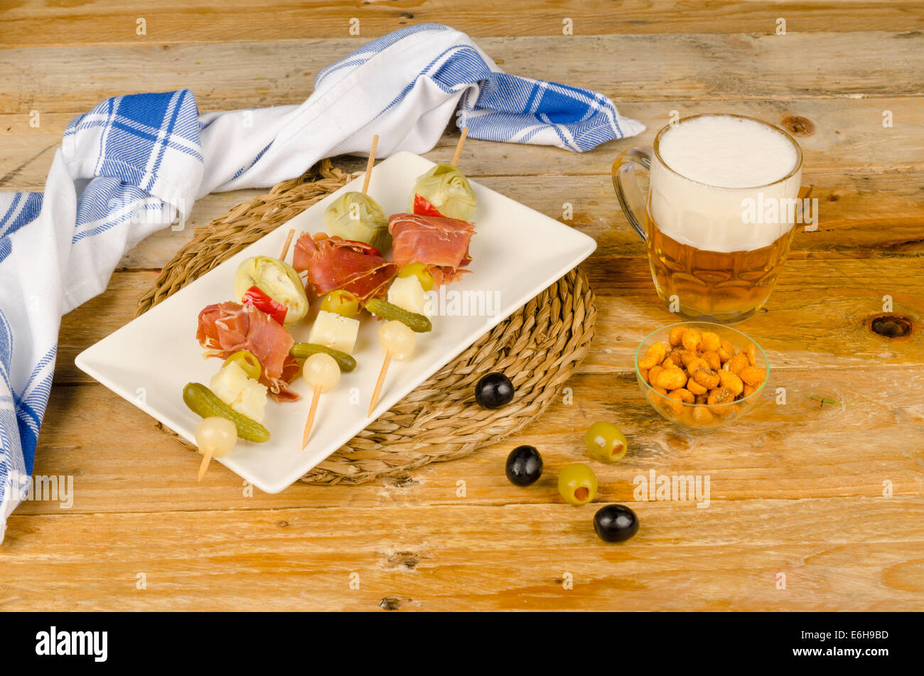 Sekwerd serrano ham tapa served with beer Stock Photo - Alamy