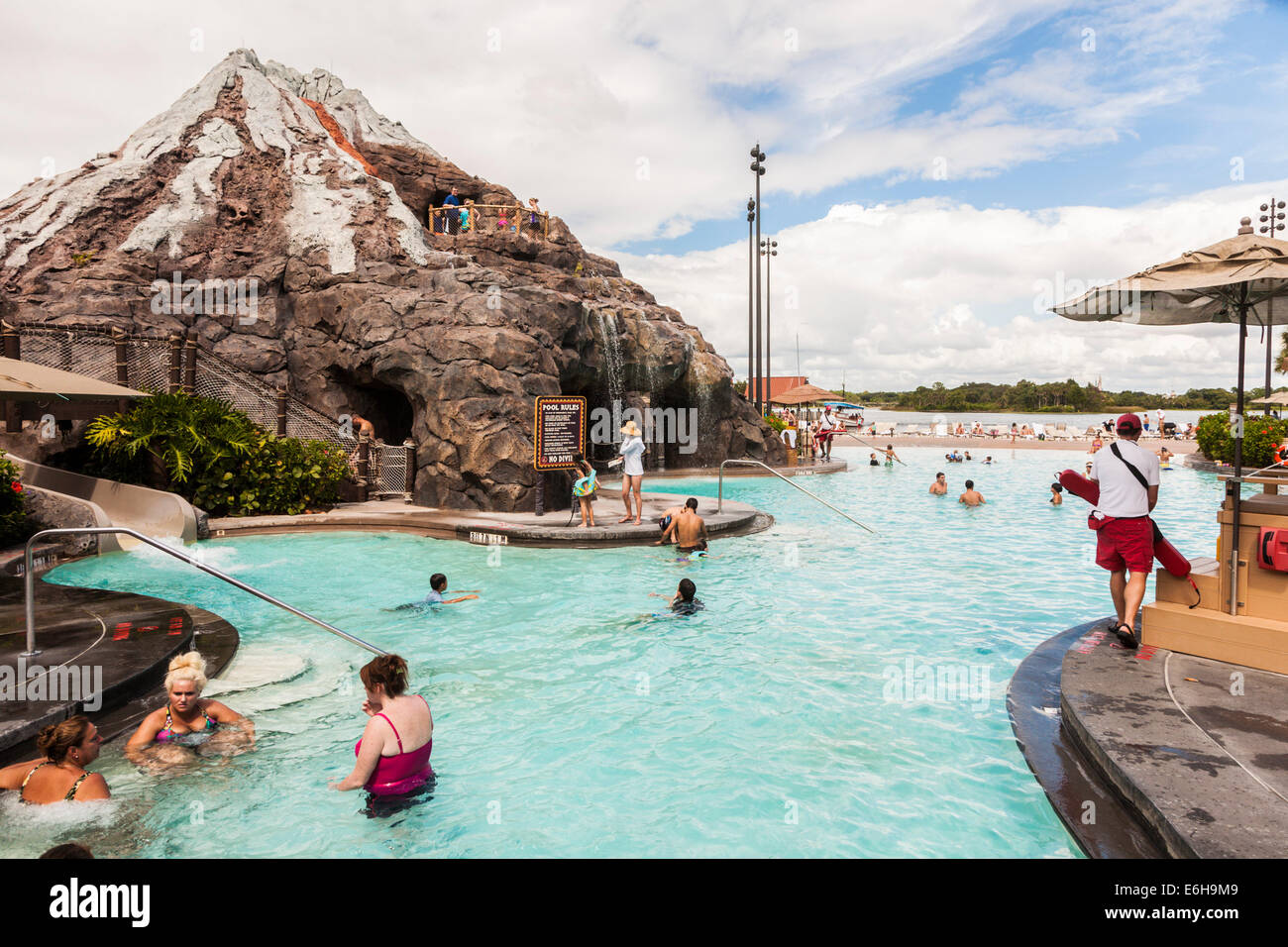 Guests enjoying the swimming pool at the Polynesian Resort in Walt ...