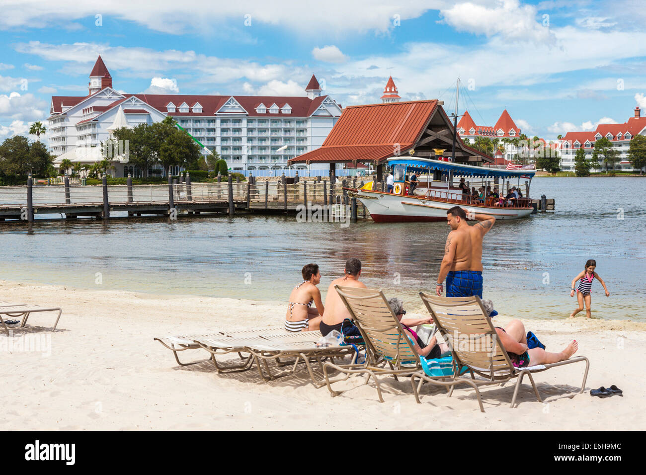 Disney's Polynesian Resort guests enjoy the beach overlooking the Grand ...