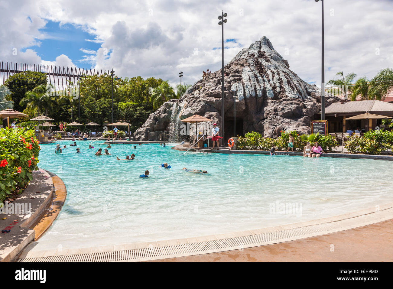 Lifeguard keeps an eye on guests enjoying the swimming pool at the ...