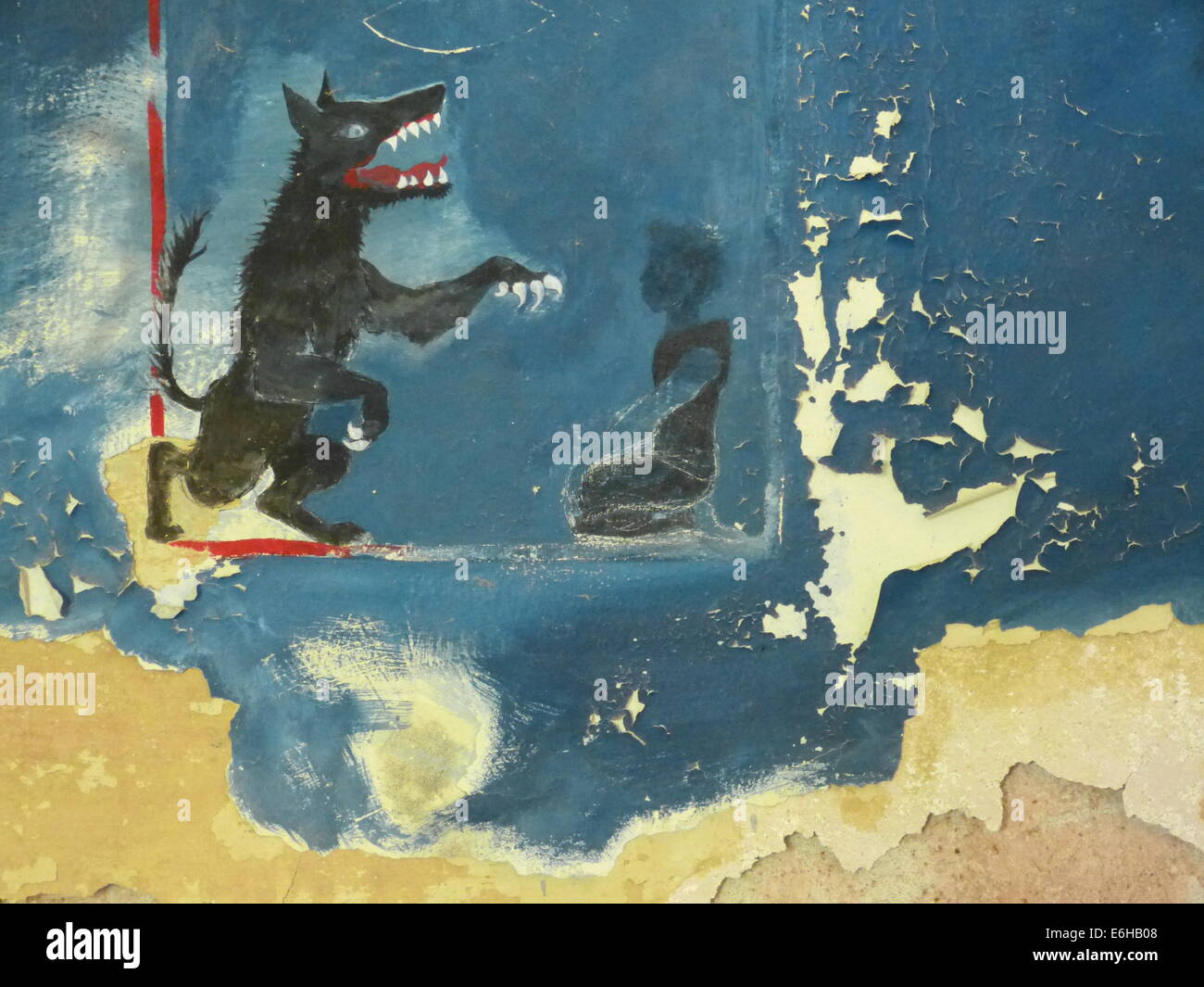 A creepy mural of a wolf attacking a boy on a wall in the old hospital ...