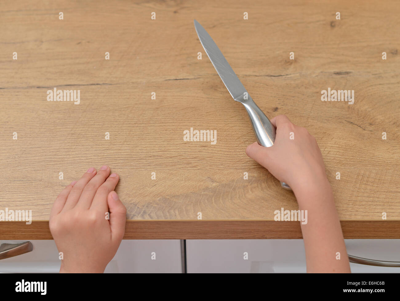 Dangerous situation in the kitchen. Child is trying to get a kitchen ...