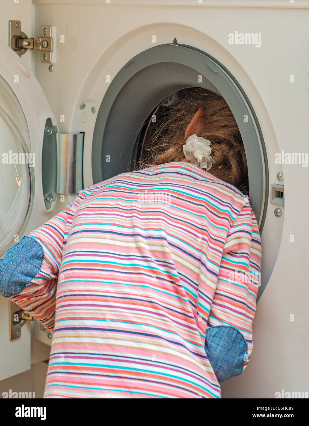 Child girl washing machine hi-res stock photography and images - Alamy