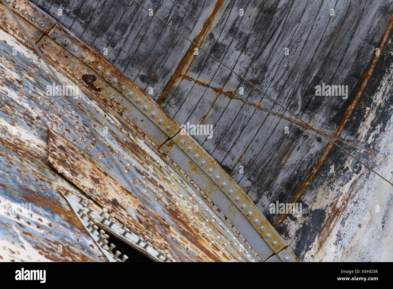 Rusted metal structure with bolts and rivets provided abstract design ...