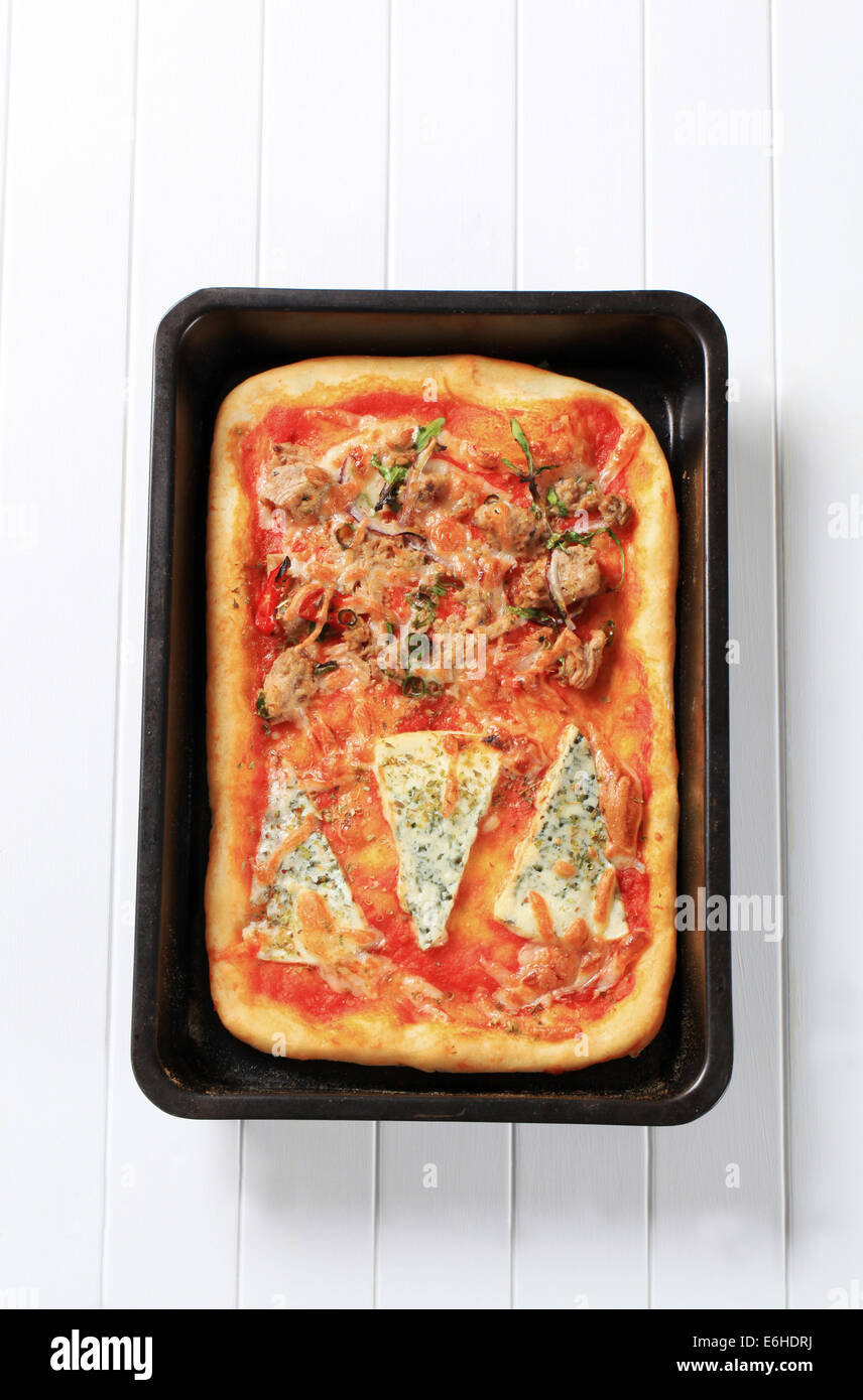 Rectangular pizza topped with blue cheese and tuna Stock Photo - Alamy
