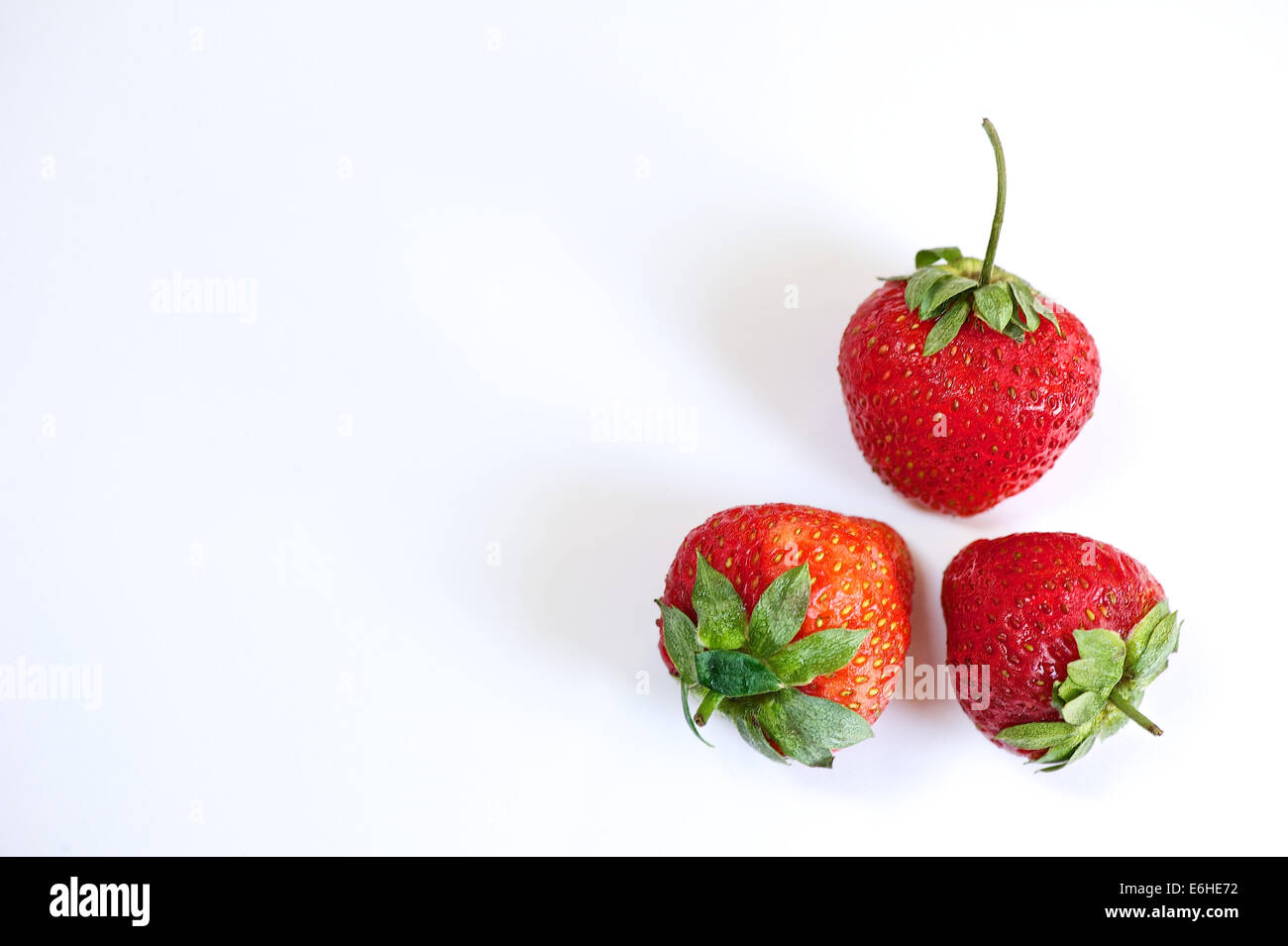 Photo of 3 Strawberries on a plain white background Stock Photo - Alamy