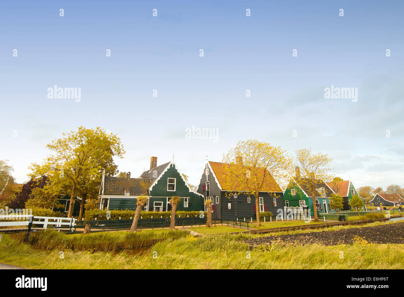 rural dutch scenery of small old houses and canal in Zaanse ...